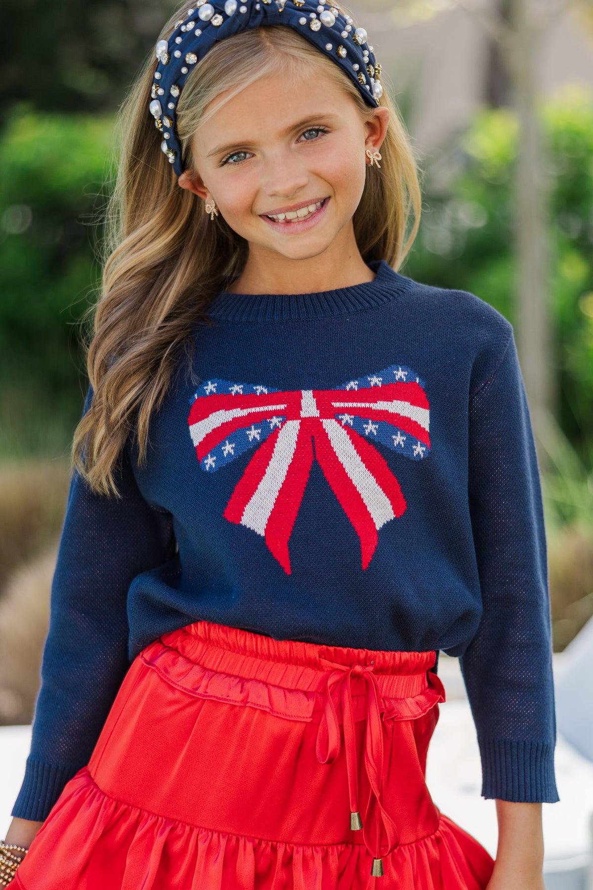 Girls: The Ansley Navy Bow Flag Sweater – Shop the Mint