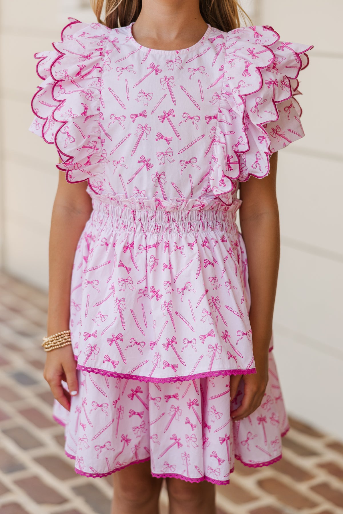 Girls: The Blaire Pink Pencils & Bow Dress – Shop the Mint
